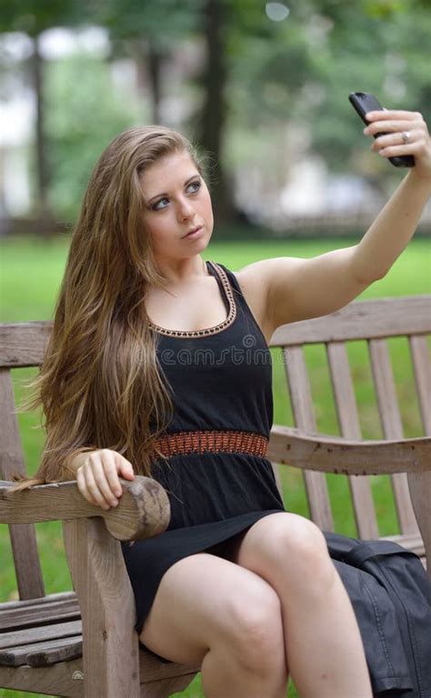 Young Woman In Black Dress Taking A Selfie Photo Stock Image Image Of