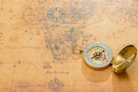 Premium Photo Old Compass On Vintage Map