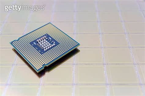 Photo of a Computer Chip CPU put on silicon wafer with microchip 이미지