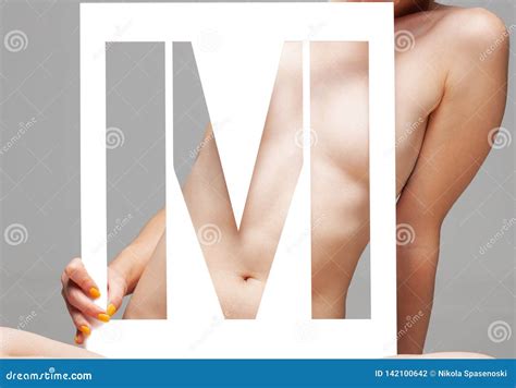 Nude Girl Holding Stencil Letter M Stock Photo Image Of Holding