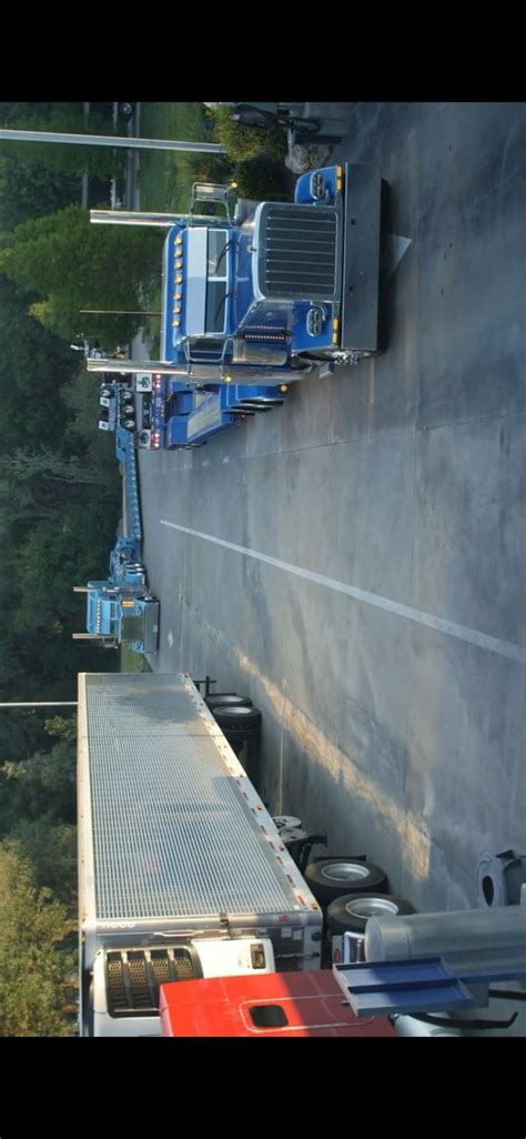 Two Trucks Parked On The Side Of The Road