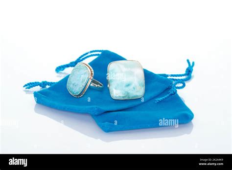 Blue larimar tumble gemstone ring on velvet bag. Collection of natural gemstones accessories ...