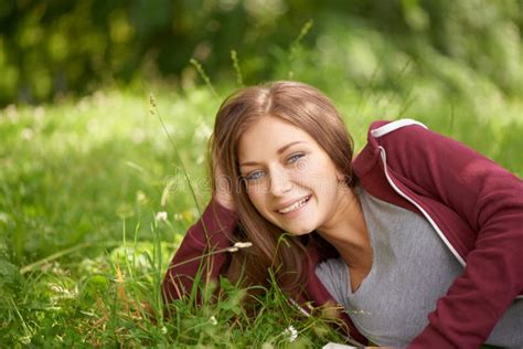 Sweet Lovely Smile A Lovely Young Woman Lying In A Green Field And