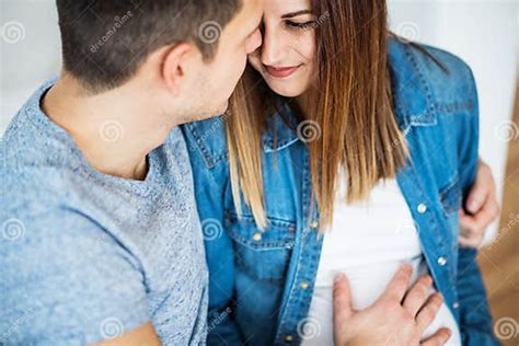 Pregnant Woman And Her Partner Touching Her Belly Stock Image Image