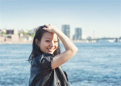 Beautiful Young Woman With Long Black Hair Smiling In The City Stock