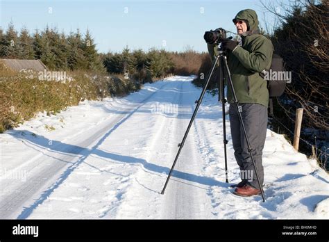 Photographer Photographing Snow Scene Ireland Stock Photo Alamy