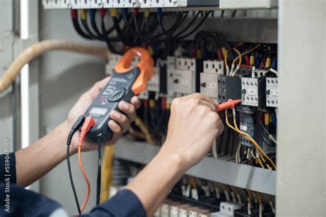 Electrician Engineer Work Tester Measuring Voltage And Current Of Power