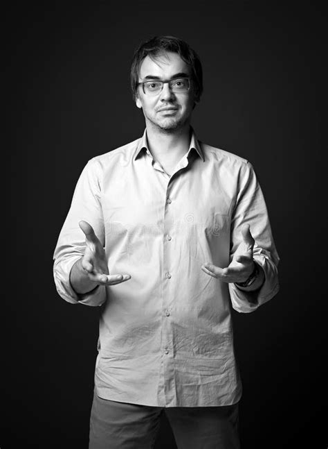 Black And White Portrait Of Unshaved Adult Man In Shirt And Jeans