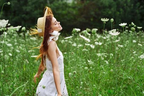 Premium Photo Young Woman Wearing Hat On Field