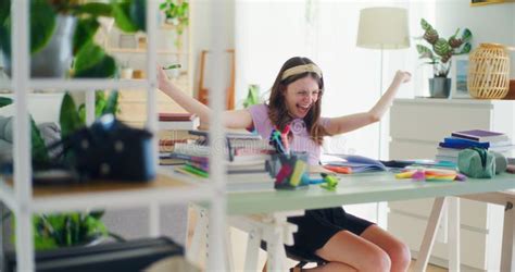 A Young Girl Does Her Math Homework And Uses A Calculator While
