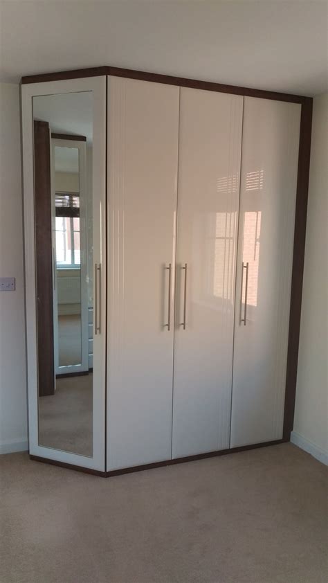 Fitted Wardrobe With Angled End Door And Recessed Mirror With Dark