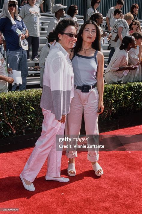 American Actress Ming Na Wen Wearing A Blue Vest With Dark Blue Trim