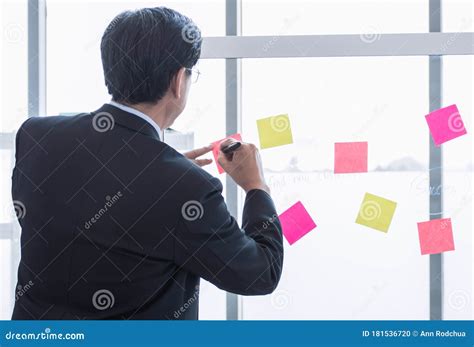 Business Man Is Writing On Sticky Notes Stock Photo Image Of Office Corporate 181536720