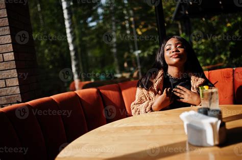 Fashionable African American Woman At Restaurant Drink Lemonade