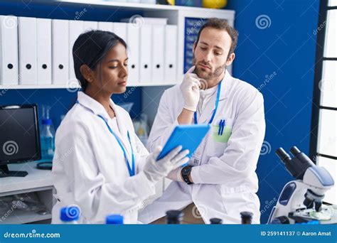 Man And Woman Scientists Using Touchpad Working At Laboratory Stock Image Image Of Science
