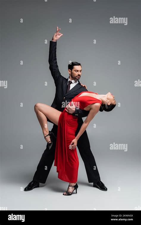 Elegant Man Posing While Performing Tango Choreography With Partner On