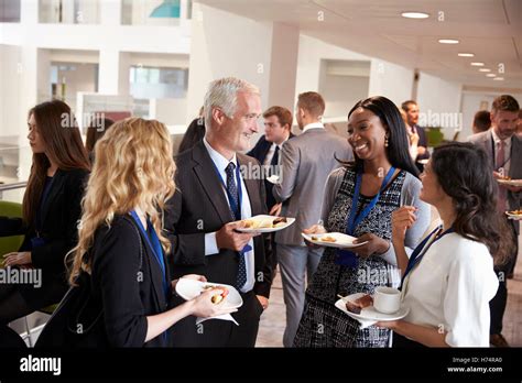 Delegates Networking During Conference Lunch Break Stock Photo Alamy