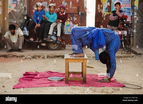 Professional Contortionist Street Performer Doing Yoga Tricks On Side