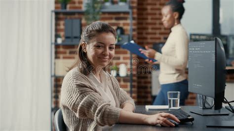 Programer Typing Source Code On Computer Keyboard Turning Head And