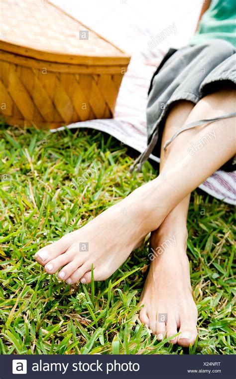 Womans Bare Feet Legs Crossed At Ankle Stock Photo Getty