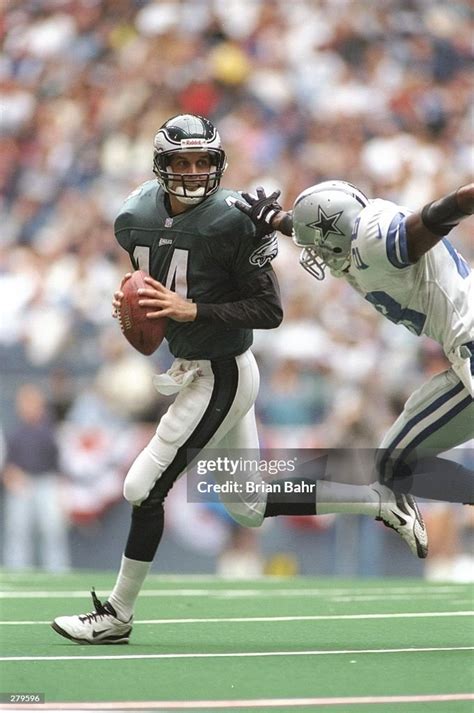 Quarterback Ty Detmer Of The Philidelphia Eagles Rolls Out To Pass