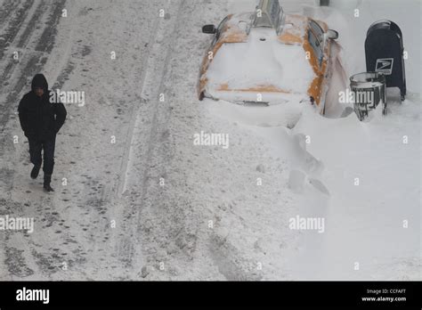 Cars Trying To Get Around In The Snow Mta Buses Stock In The Middle Of