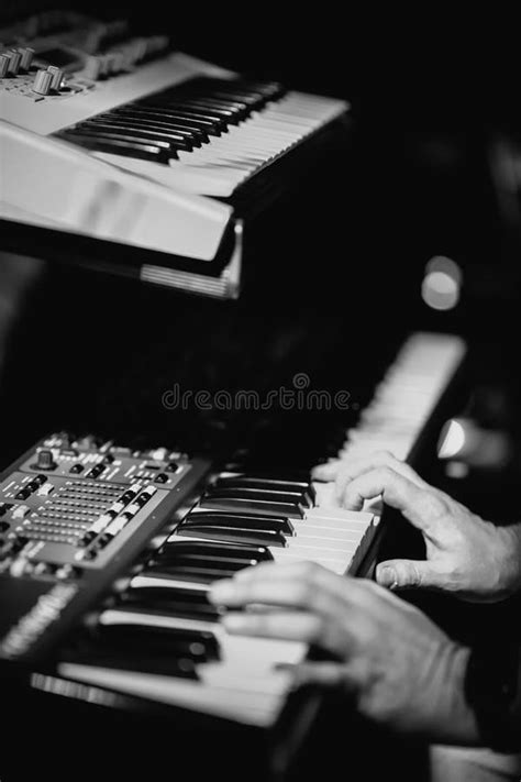 Musician Playing On The Double Keyboard Synthesizer Piano Keys