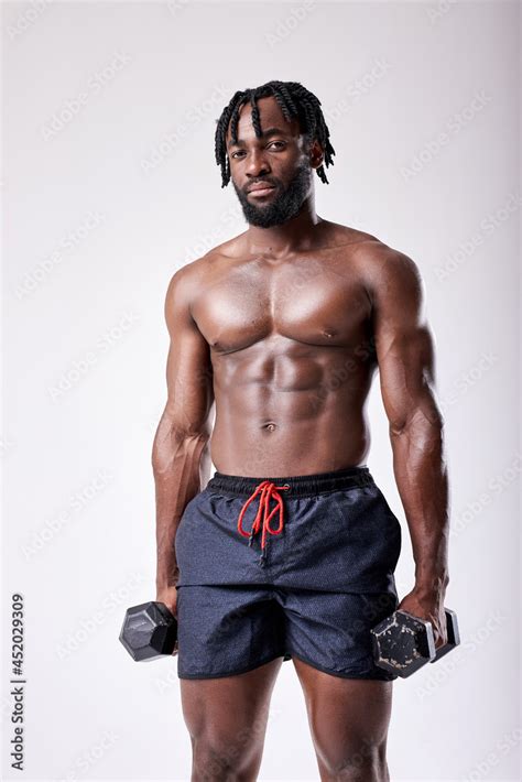 Attractive Muscular African Man Working Out With Dumbbells Photo Of Handsome Black Man With