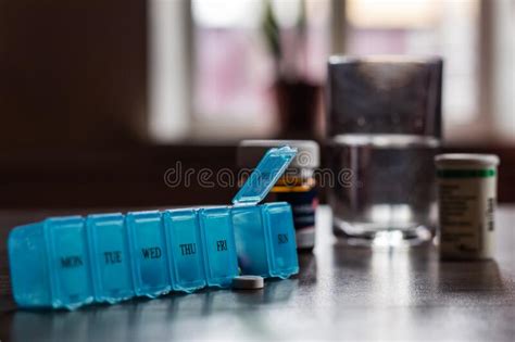 Pill Organizer With Variety Of Pills And Supplement Weekly Pill
