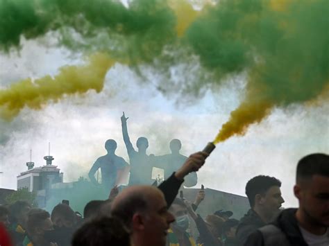Furious Manchester United Fans Storm Old Trafford Pitch In Protest