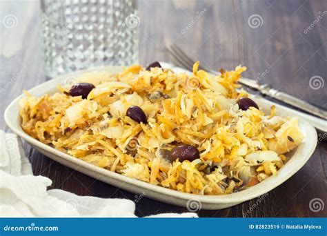 Codfish With Potato Chips And Olives On Plate Stock Image Image Of