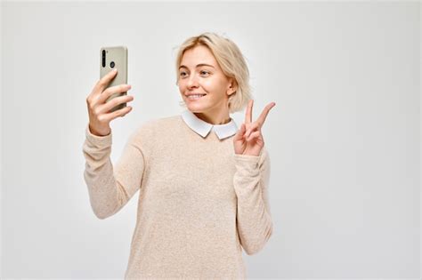 Premium Photo Portrait Of Young Blond Woman Takes Selfie Photo On