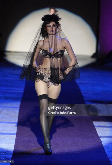 A Model Walks The Runway Wearing Carine Gilson During The Lingerie
