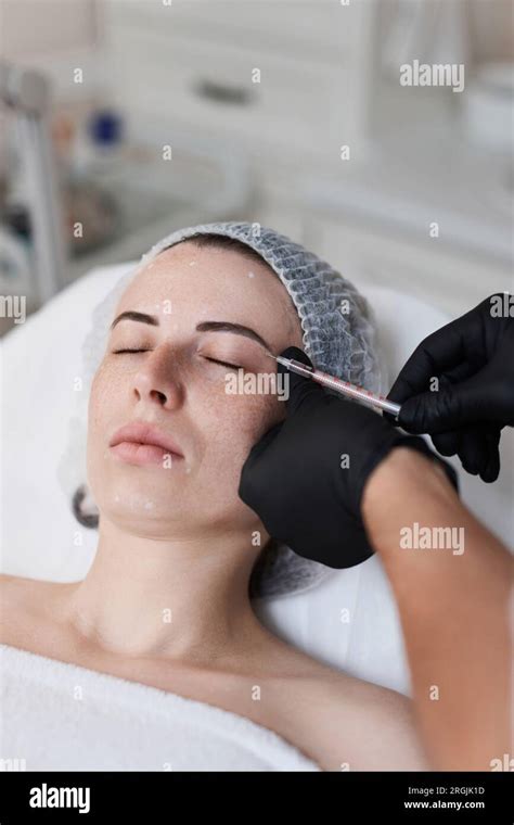 Woman Receives Cosmetic Botox Injection In Face Stock Photo Alamy