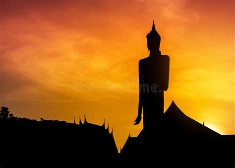 Silhouette Big Buddha Statue Standing In Thai Temple On Sunset Stock