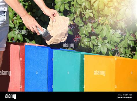 Man Throwing Garbage Into Litter Bin Outdoors Recycling Concept Stock Photo Alamy
