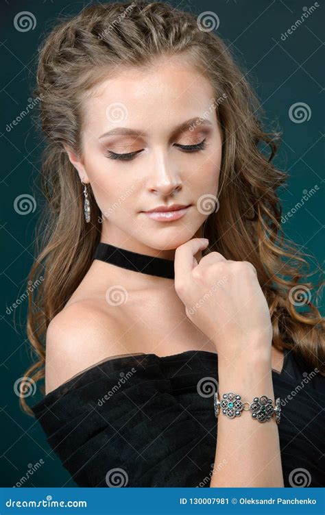 Young Pretty Girl With Fashionable Jewelry Necklace Earrings And Stock