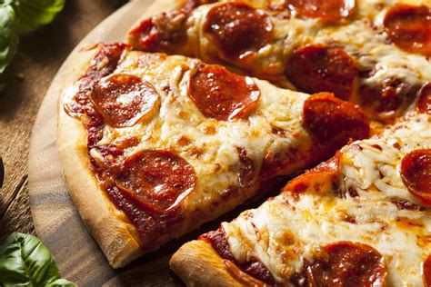 Download Pizza Slice With Cheese And Pepperoni Close Up Picture