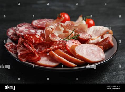 Different Types Of Sausages Served On Black Table Closeup Stock Photo Alamy