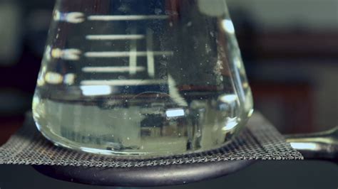 Close Up Erlenmyer Flask That Is Being Heated By A Bunsen Burners No