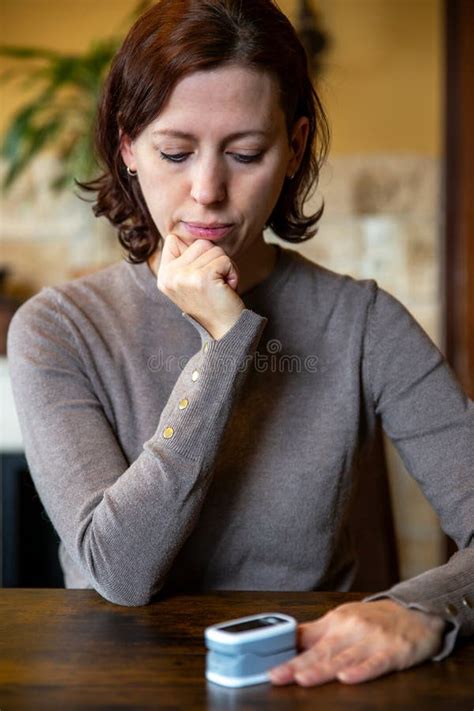 An Adult Woman Measures Her Oxygen Level On Her Finger Stock Image Image Of Medical