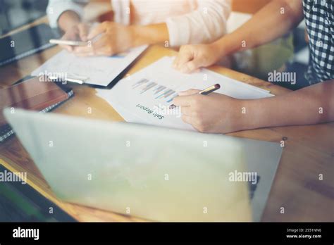 Business Team Meeting Analysis Financial Chart Together At Cafe