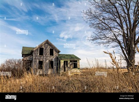 An Old Scary Abandoned Farm House That Is Deteriorating With Time With