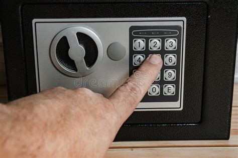 Man Entering The Opening Code On The Numeric Keypad Of The Safe Stock Image Image Of Buttons