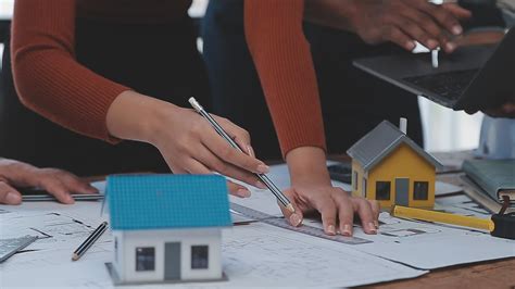 Engineer Working In Office With Blueprints Inspection In Workplace For