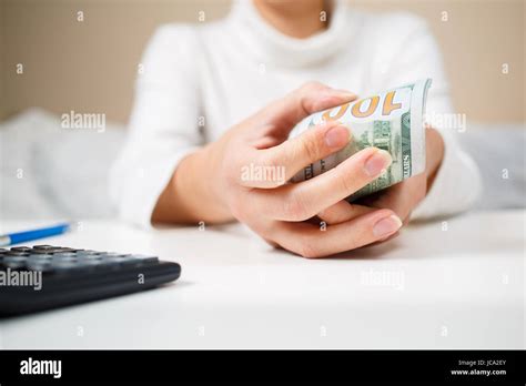 Close Up Of Woman With Calculator Counting Money Stock Photo Alamy