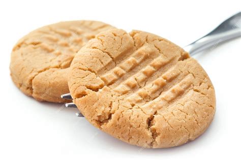 Peanut Butter Cookies With Fork Marks Isolated On White Background
