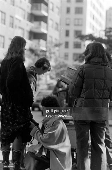 Guest Adjusts Actress Mariel Hemingways Costume On The Set Of Woody