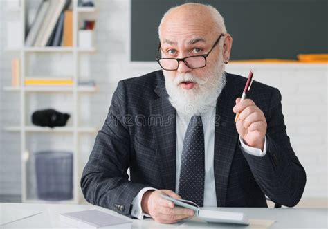 Teacher Preparing For University Exams Professor Holding A Book And Pointing Teacher In