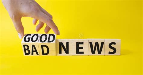 Good News And Bad News Symbol Businessman Hand Turns Wooden Cubes And